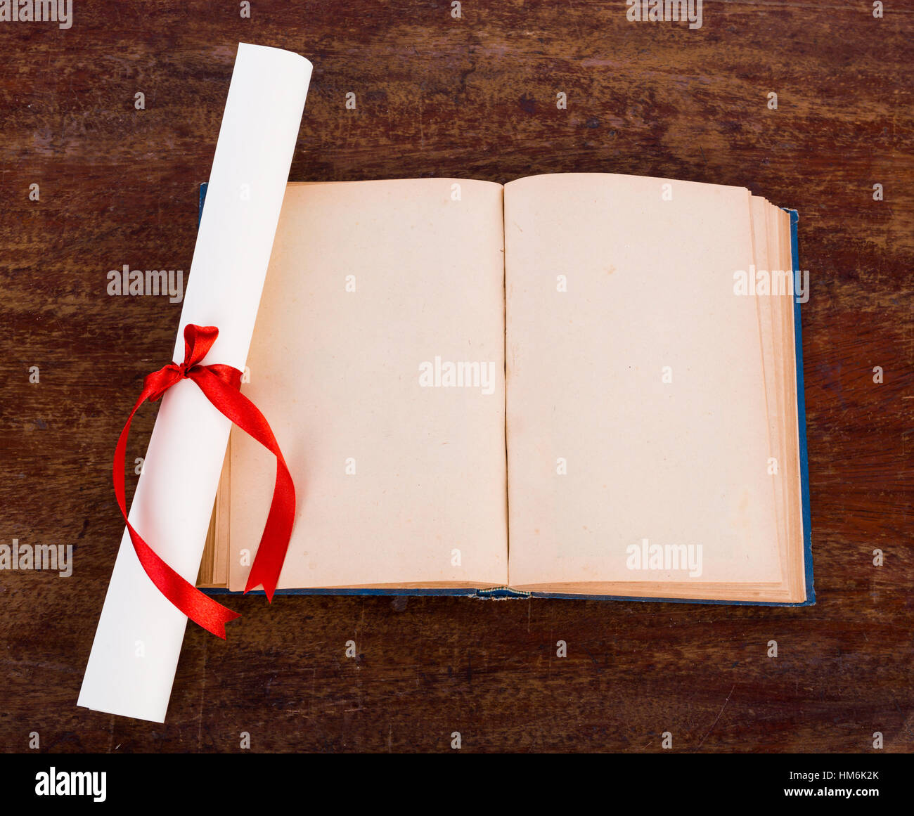 Diploma with old book Stock Photo - Alamy