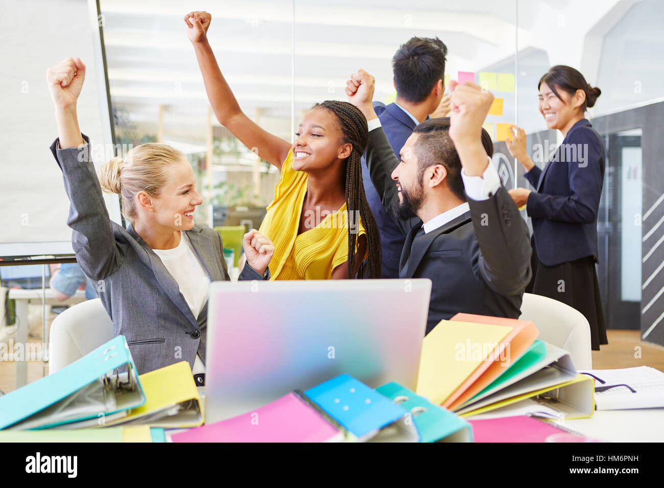 Cheering start up team celebrate success hi-res stock photography and images - Alamy