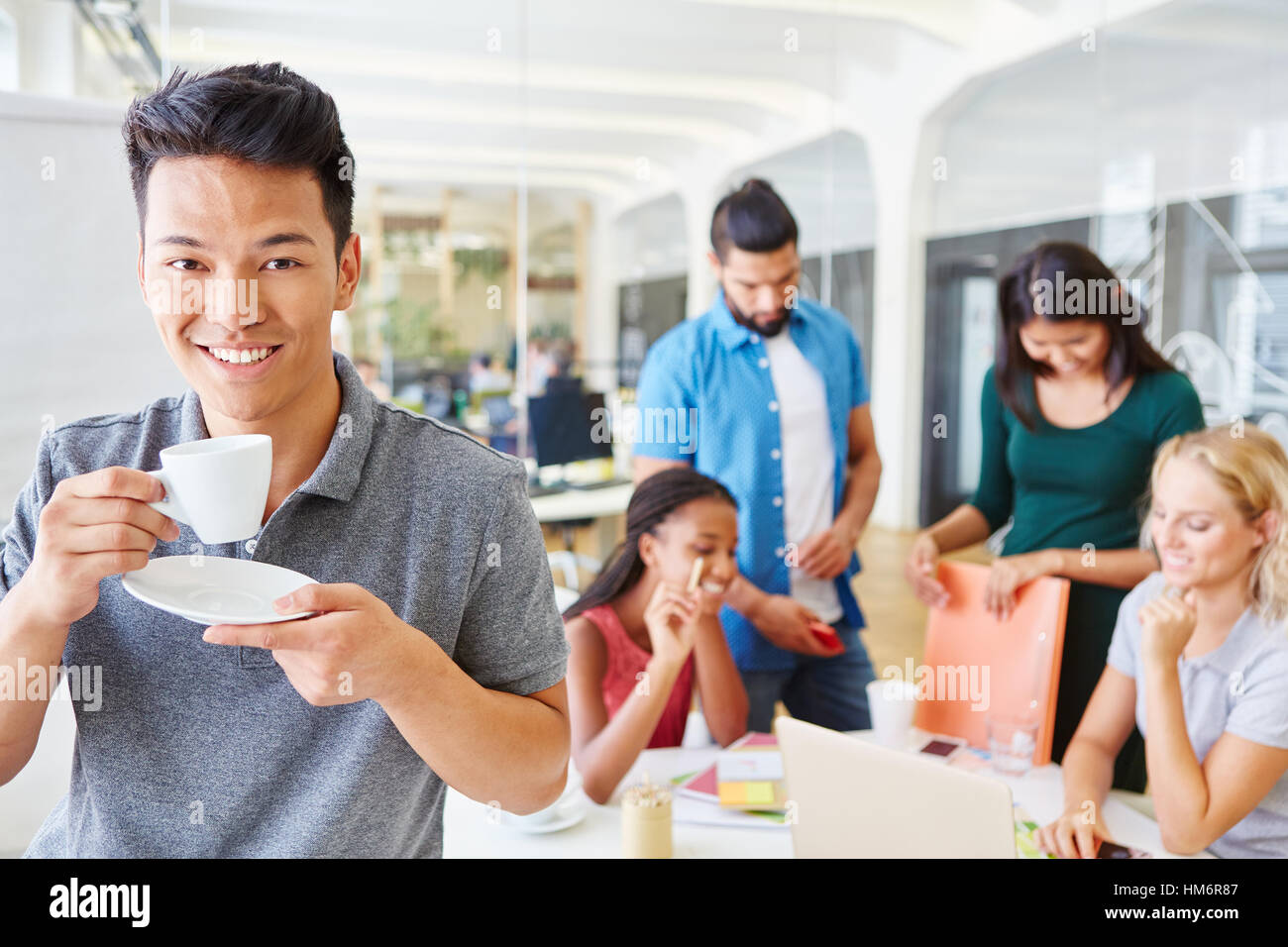 Man takes a coffee break from start-up workshop Stock Photo - Alamy