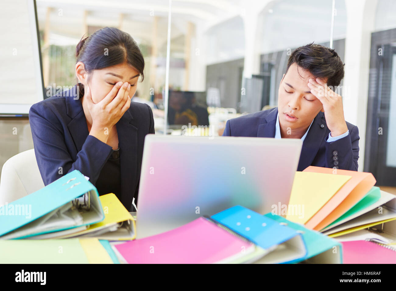 Exhausted business people in start-up working overtime Stock Photo - Alamy