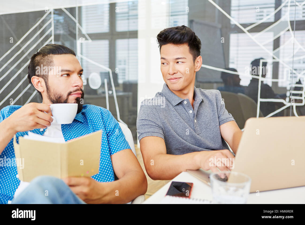 Two programmers in as start-up team working as a team Stock Photo - Alamy