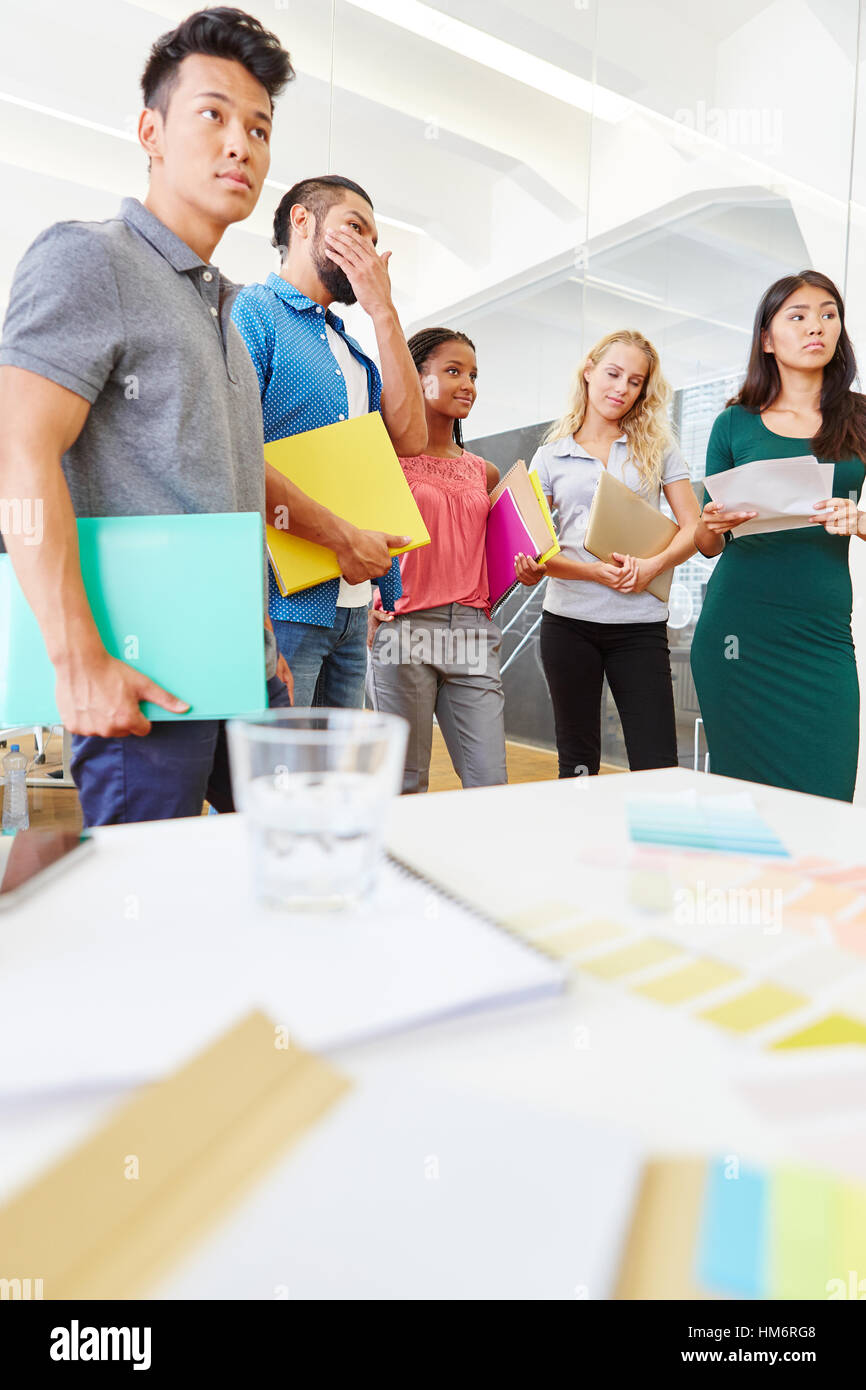 Team of students planning new start-up in meeting Stock Photo - Alamy