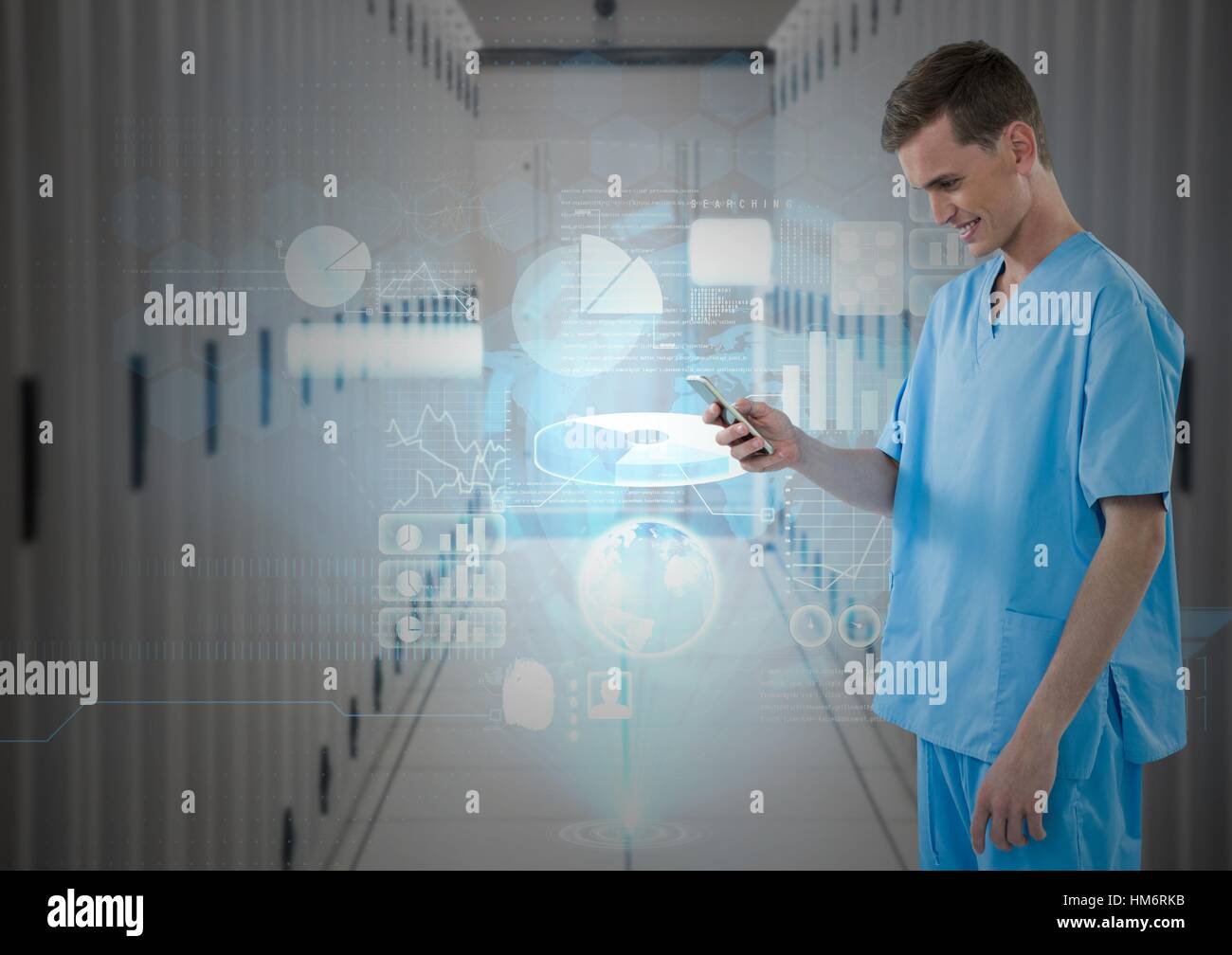 Smiling male surgeon using mobile phone Stock Photo - Alamy