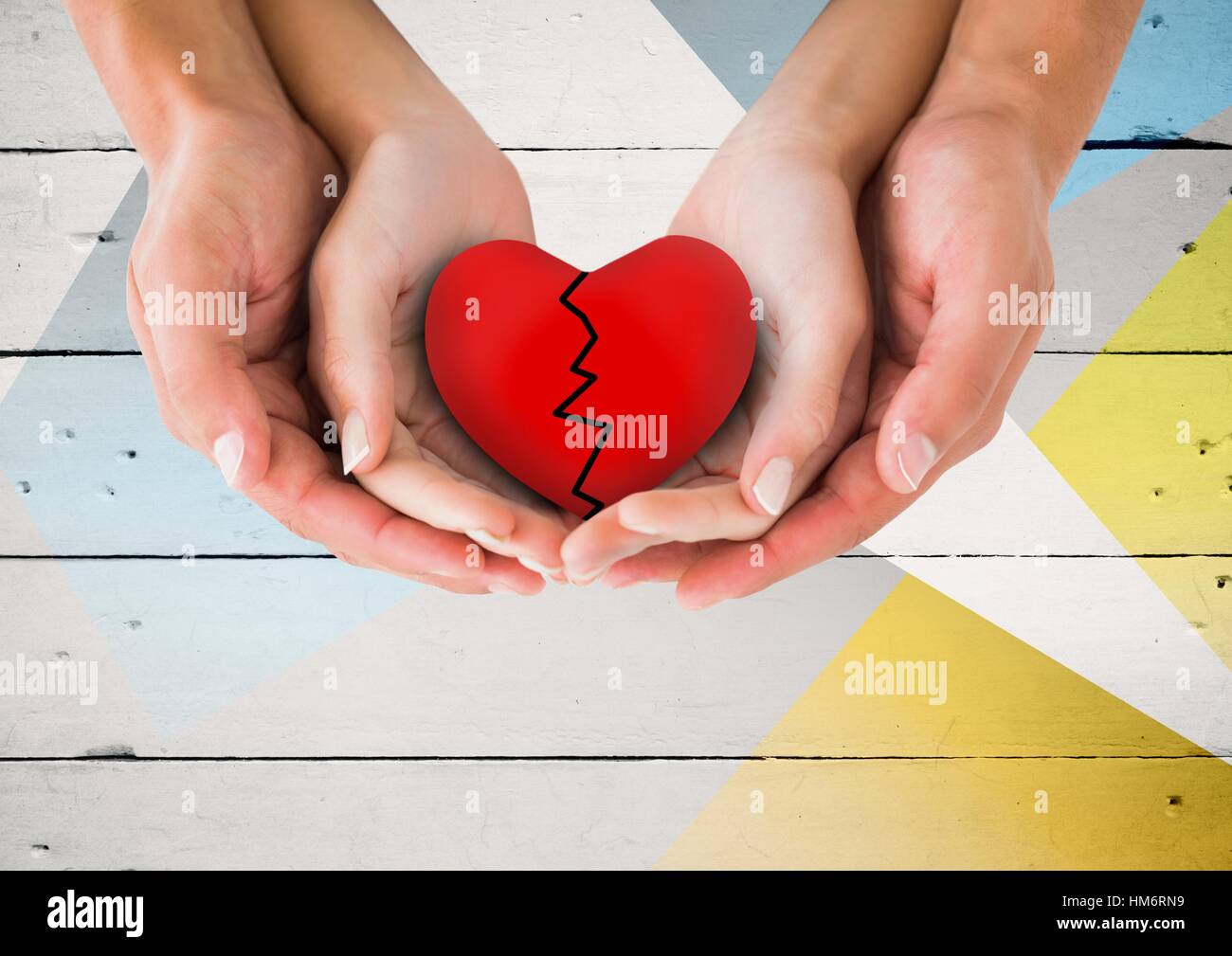 Hands holding broken heart hi-res stock photography and images - Alamy