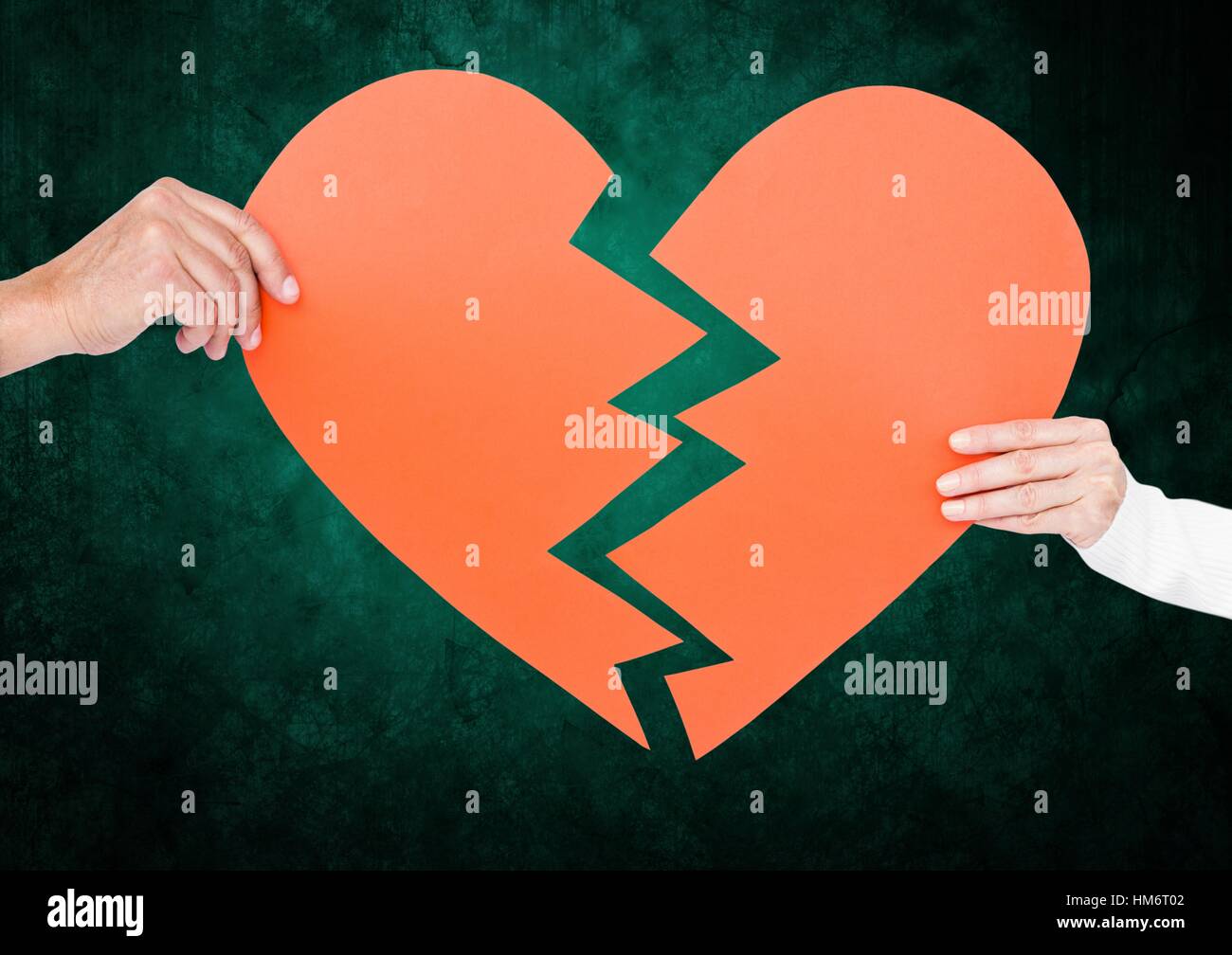 Hands holding broken heart hi-res stock photography and images - Alamy