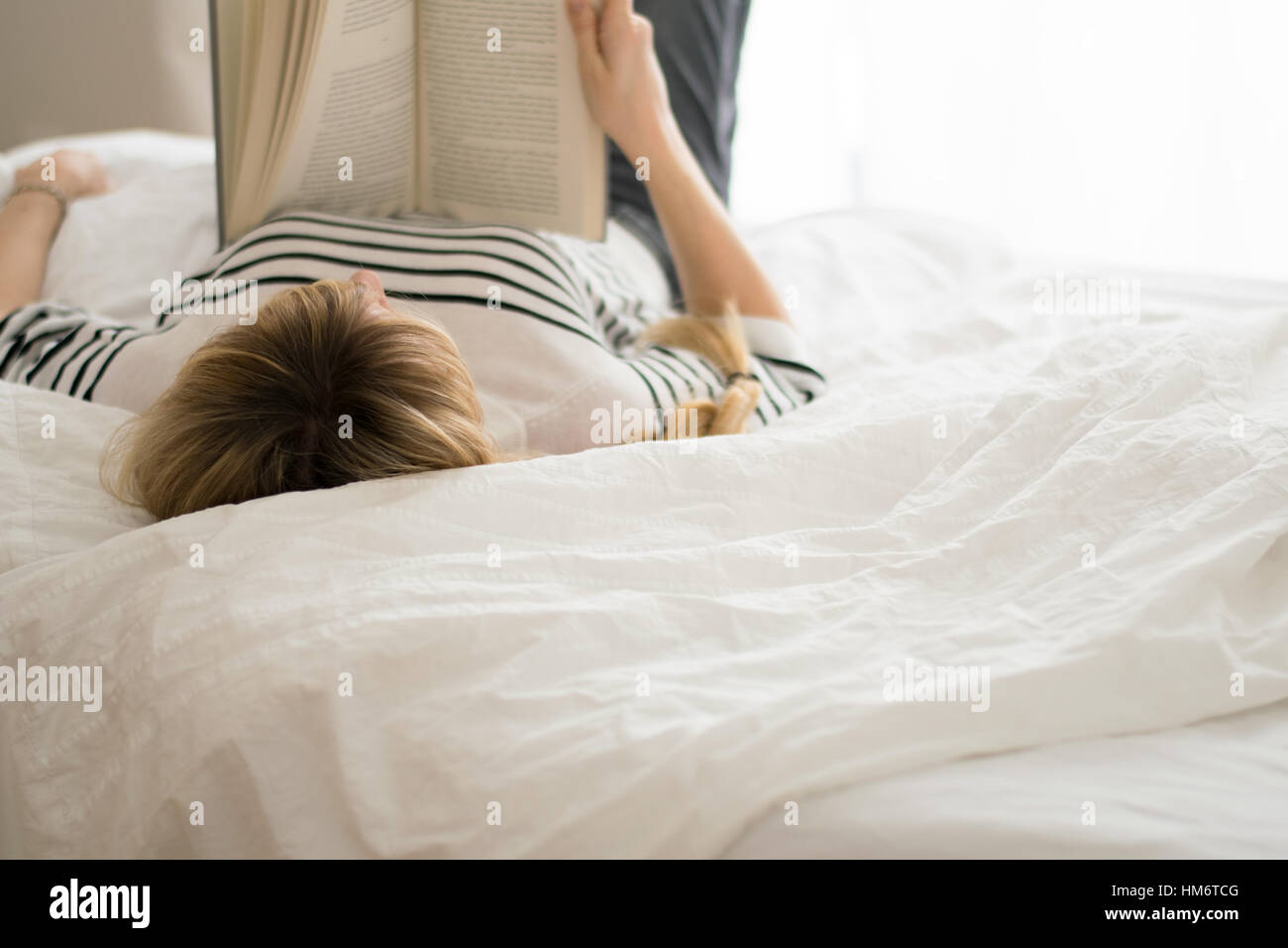 Sunday morning reading Stock Photo - Alamy