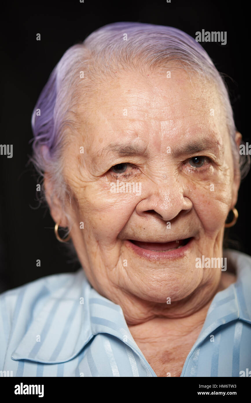 portrait of smiling grandma isolated on black background Stock Photo ...