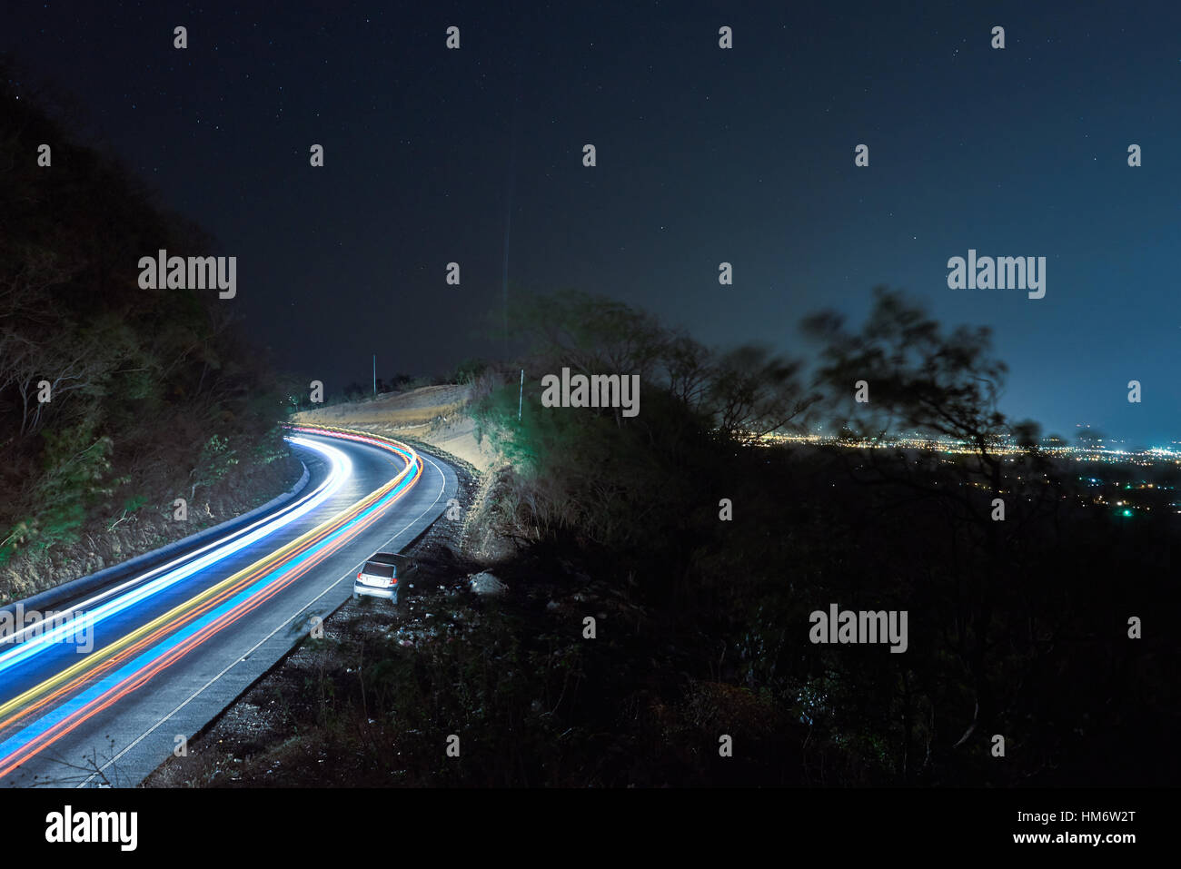 colour road traffic light with city line at night Stock Photo - Alamy