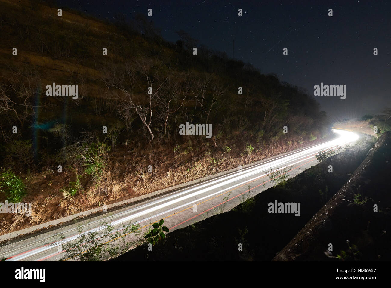 traffic light at mountain narrow road at night Stock Photo - Alamy