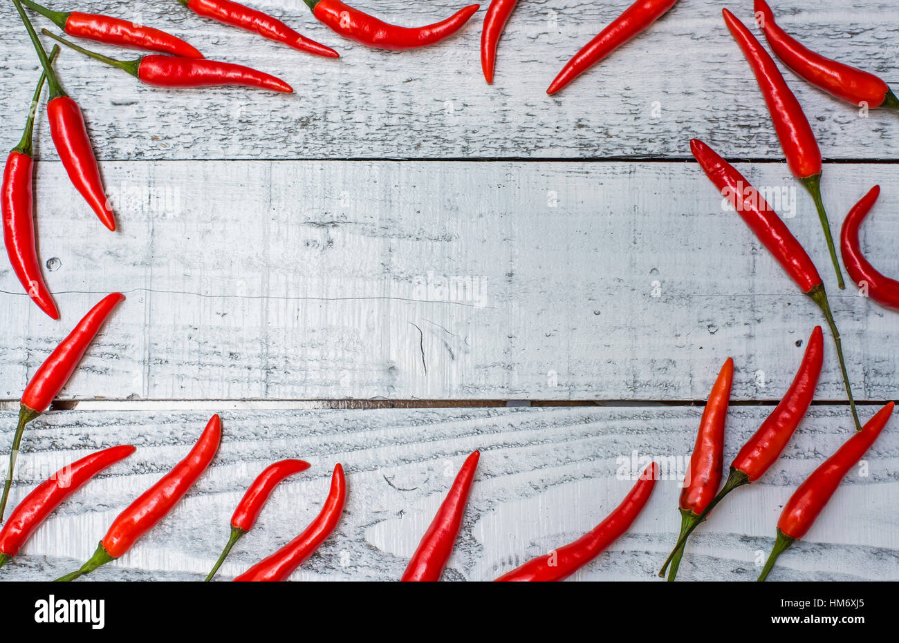 Hot and spicy red chilli on wood table background Stock Photo - Alamy