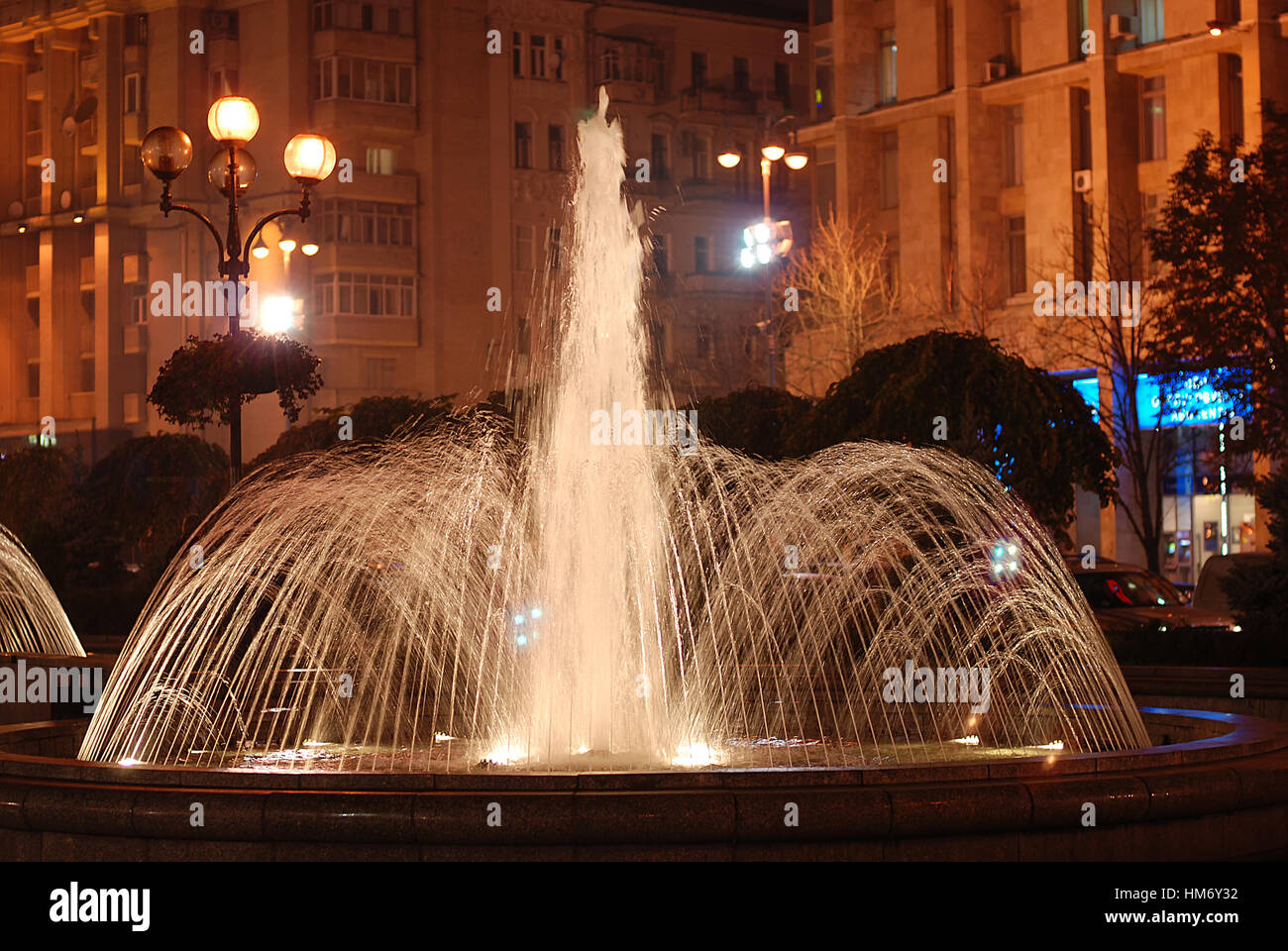 the Large fountain in the night square Stock Photo - Alamy