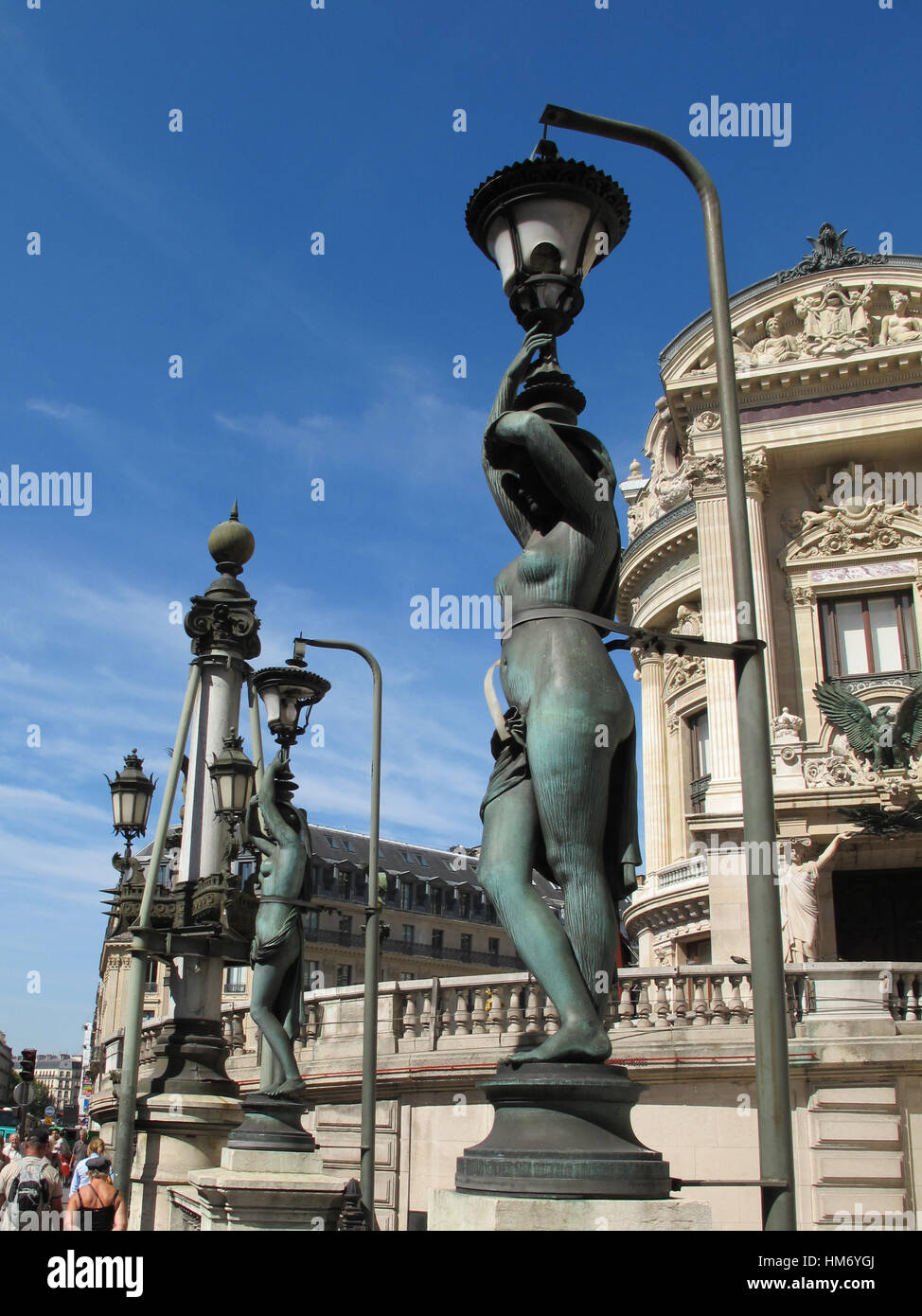 Bronze statues facing Opera Garnier, Paris Stock Photo - Alamy