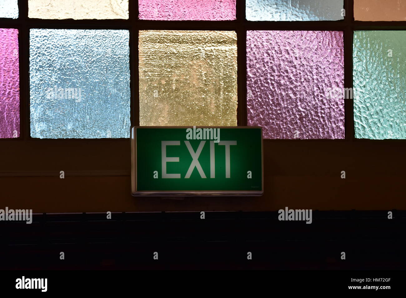 Exit sign with white block letters glowing green Stock Photo - Alamy