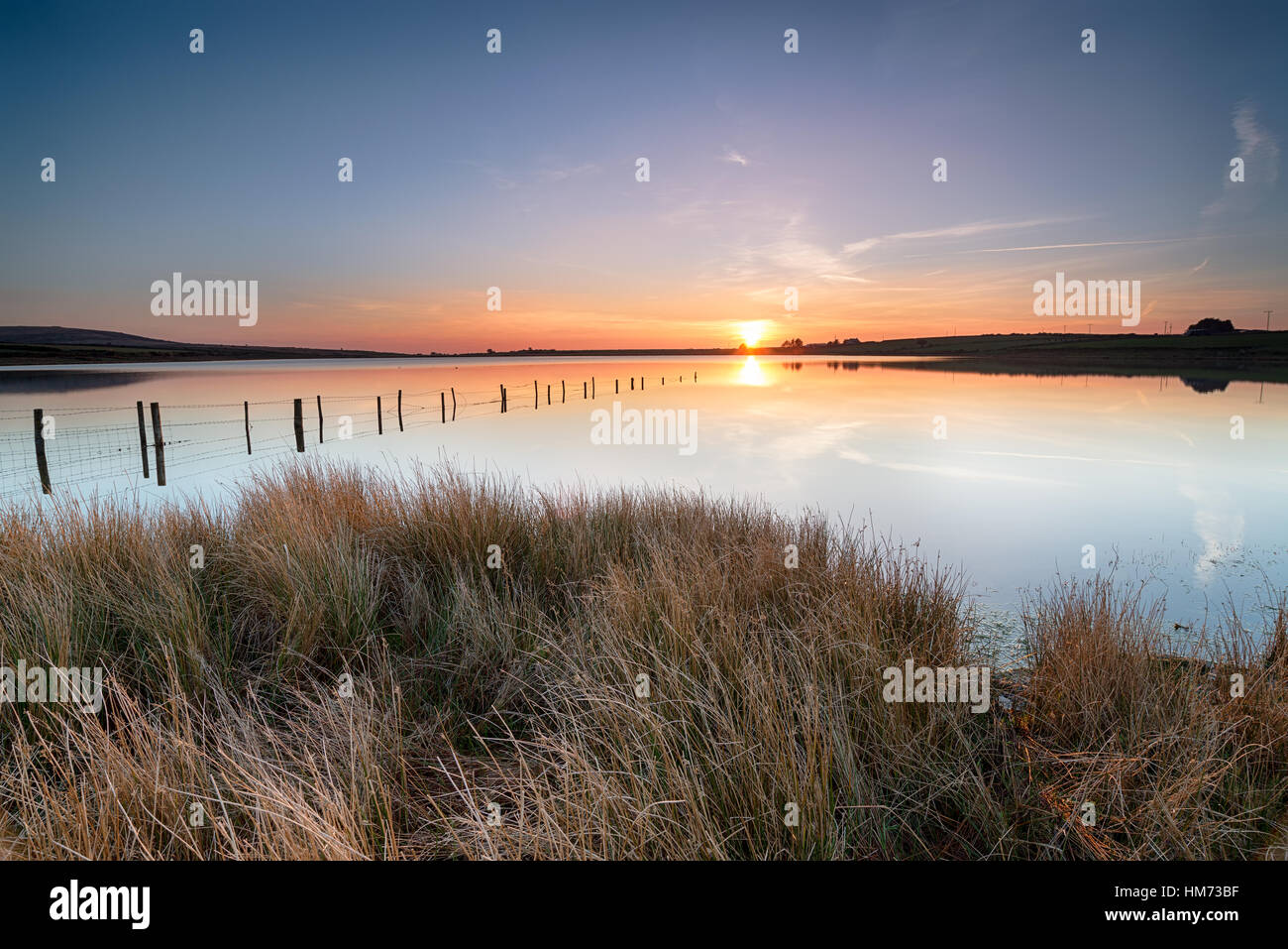 Stunning sunrise over dozmary pool hi-res stock photography and images ...