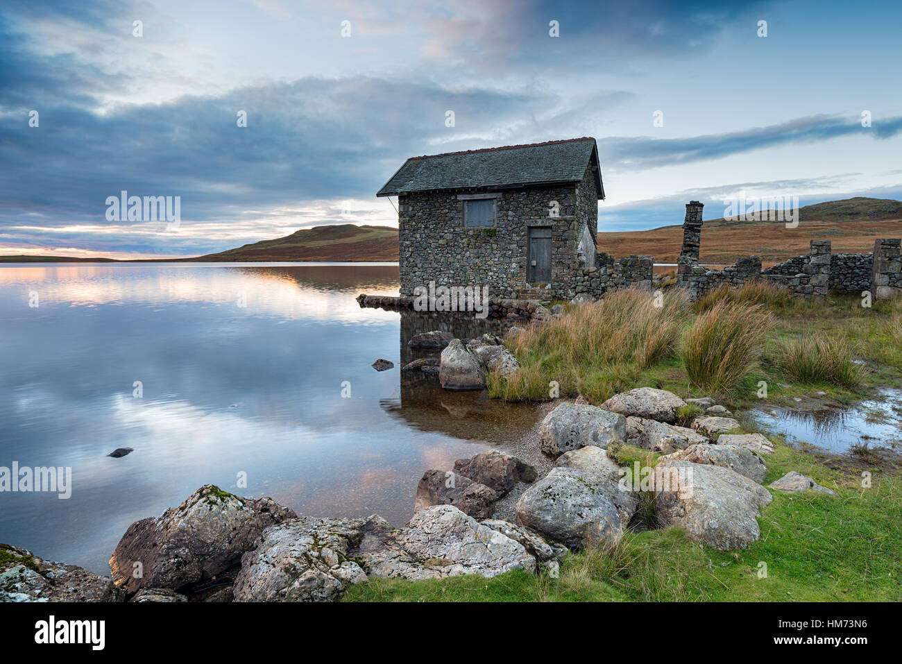 A pretty old stone boathouse on the shores of Devoke Water on Birker ...