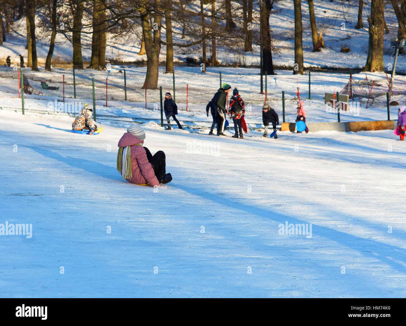 children love the winter sledding downhill fun Stock Photo - Alamy