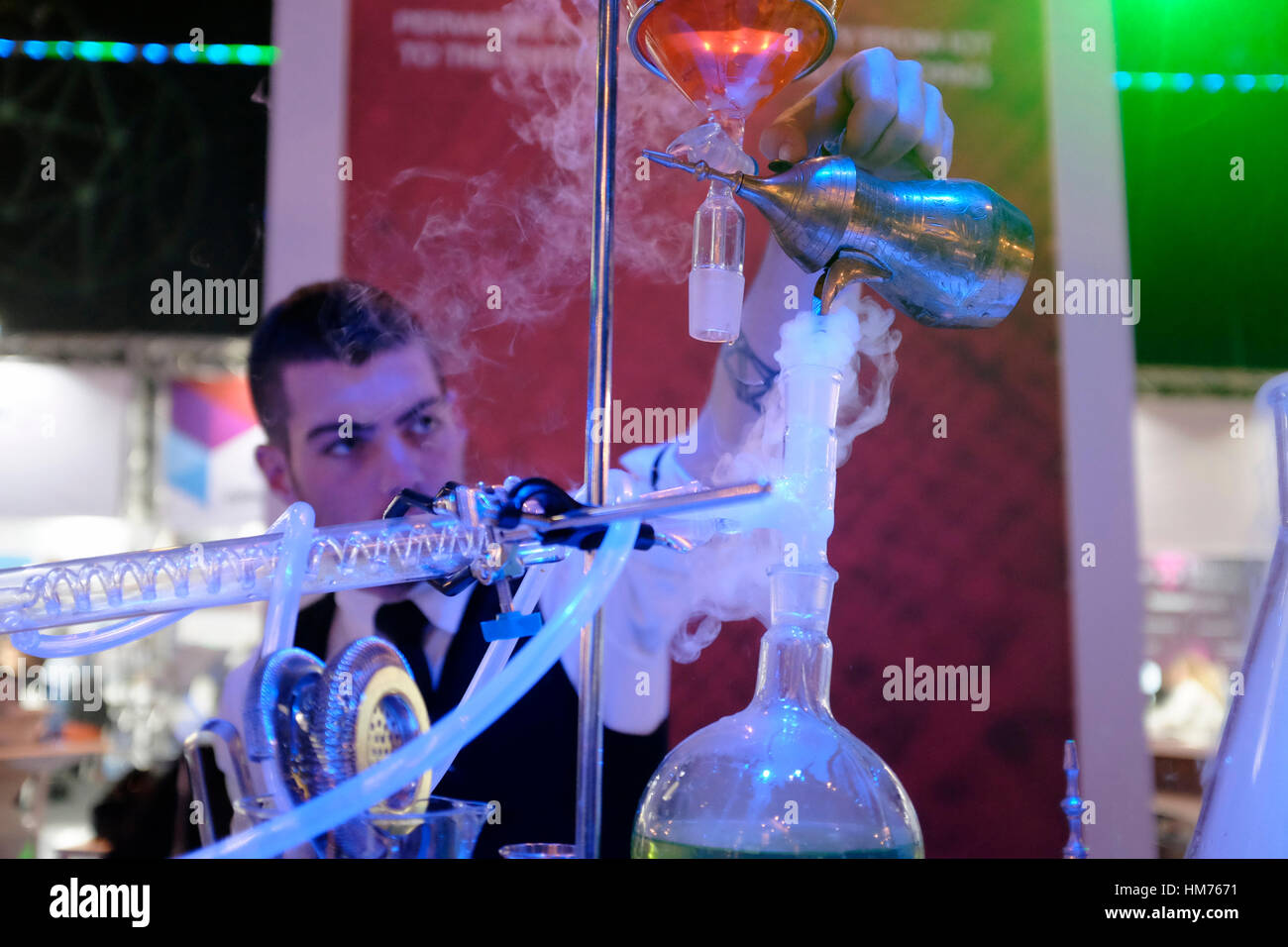 A barman preparing a molecular alcoholic cocktail using the equipment ...