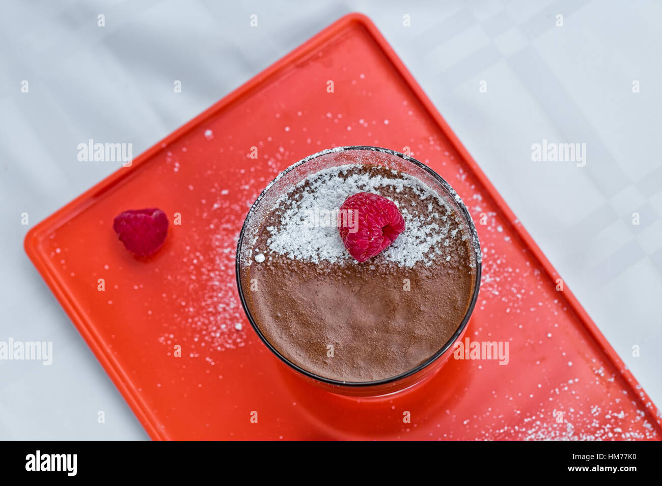 Homemade chocolate mousse with fresh raspberries on a table, top view ...