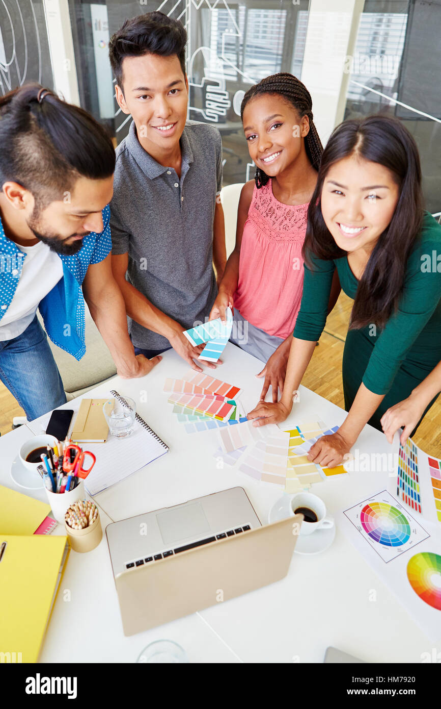 Young and multicultural team in creative workshop Stock Photo - Alamy