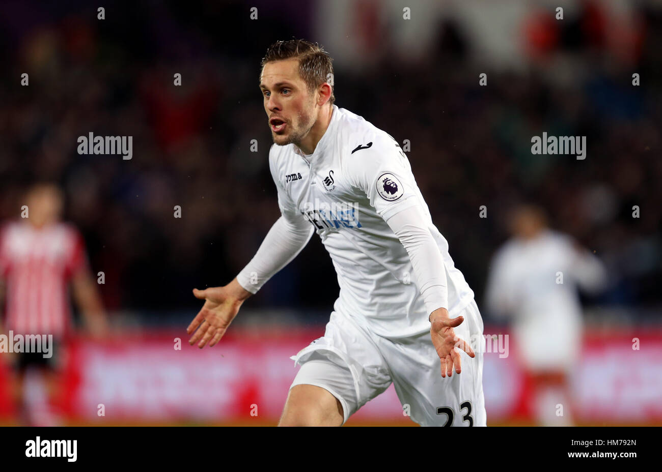 Swansea City's Gylfi Sigurdsson celebrates scoring his side's second ...