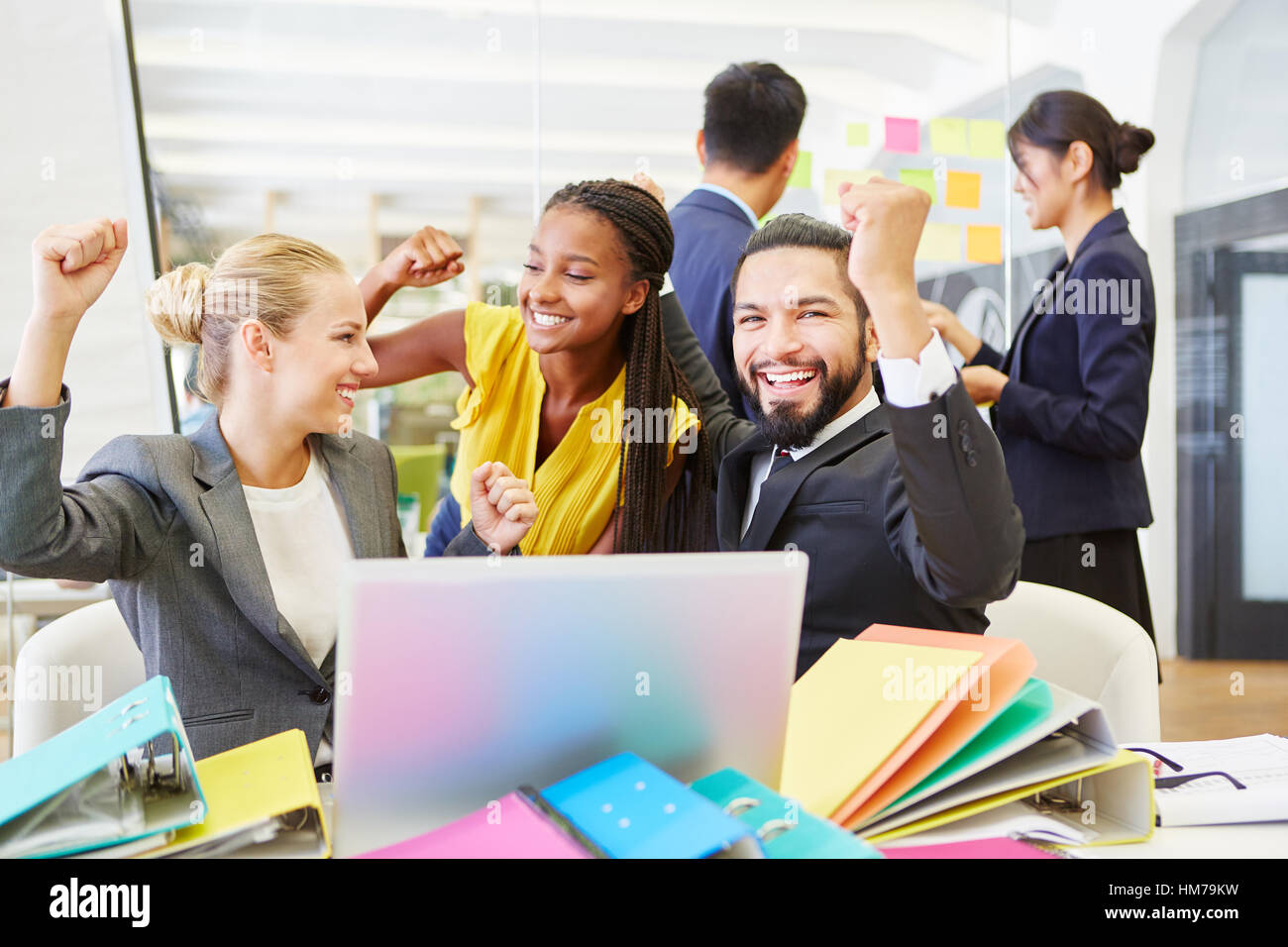 Successful start-up team celebrating together at work Stock Photo - Alamy