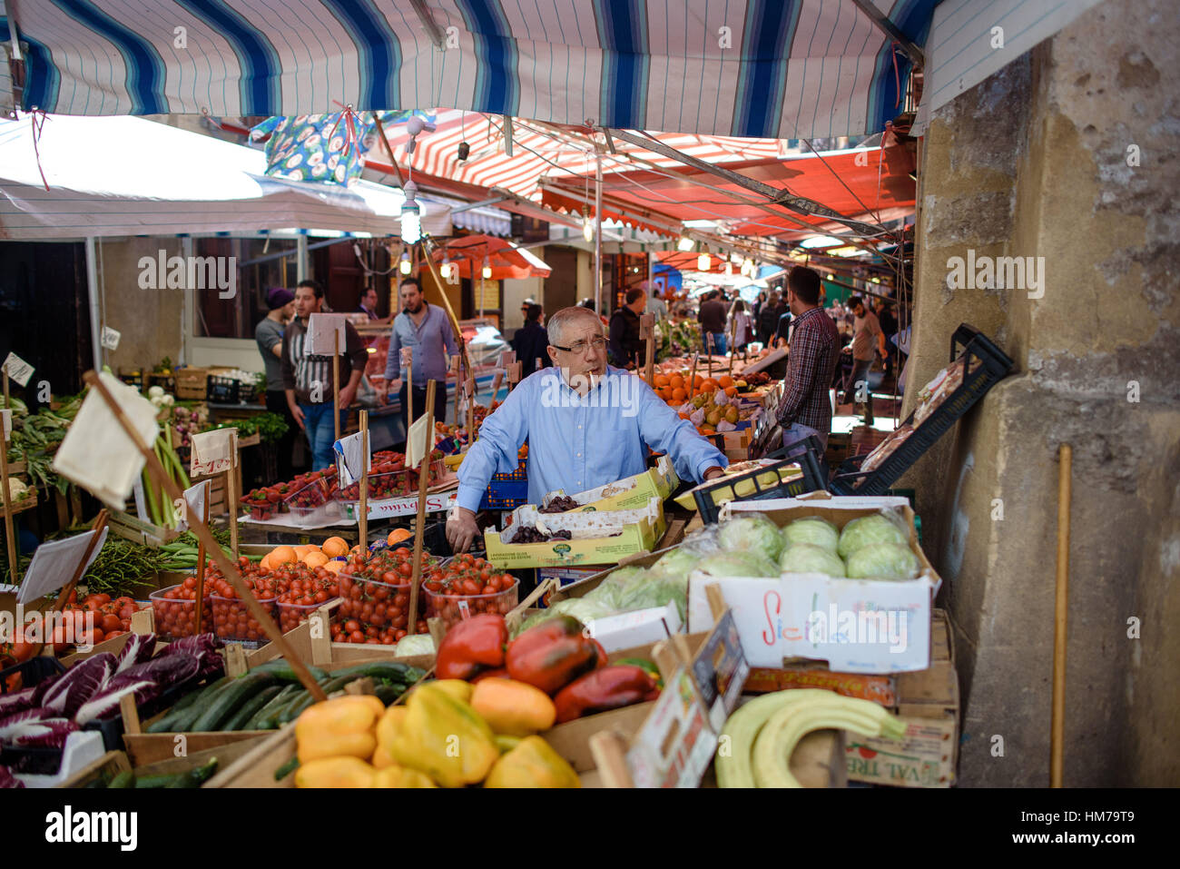 Seller with cigarette at a market in Palermo, Sicily Stock Photo - Alamy