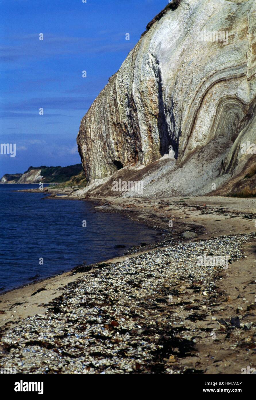 Rocks with geological stratifications on the beach on Fur island ...