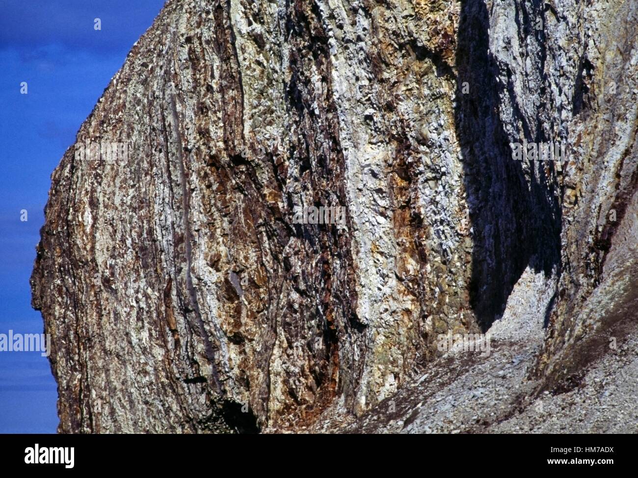Rocks with geological stratifications on the beach on Fur island ...