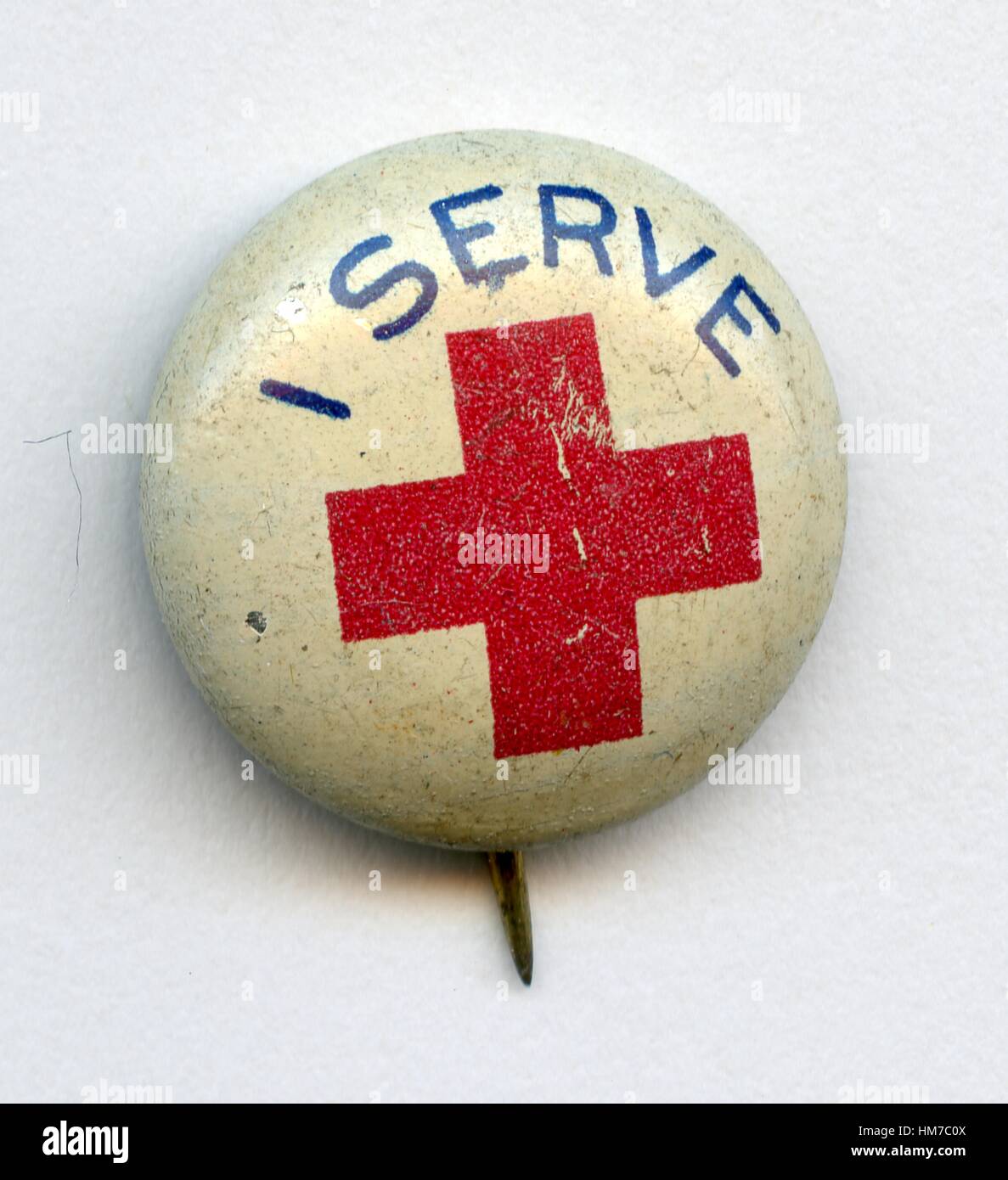 Pinback button in red, white and blue promoting the American Red Cross ...