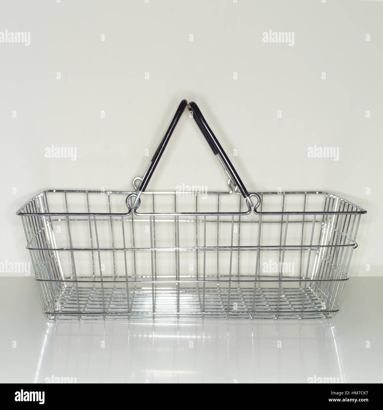 Empty wire basket Stock Photo - Alamy