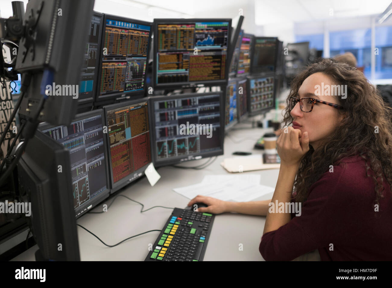 Young woman analyzing computer data Stock Photo - Alamy