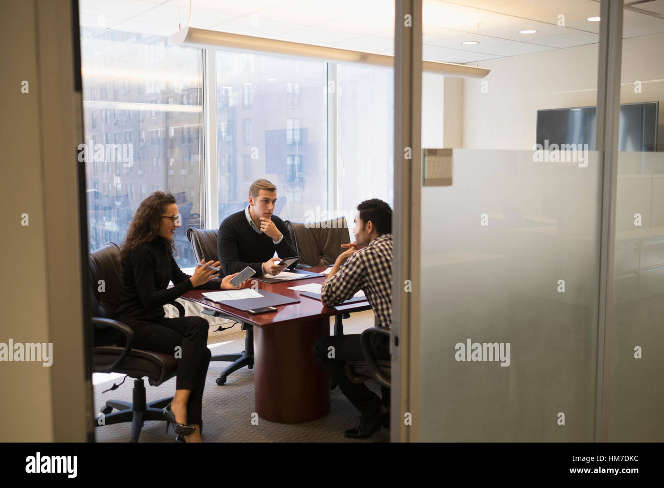 Young business people having meeting in conference room Stock Photo - Alamy