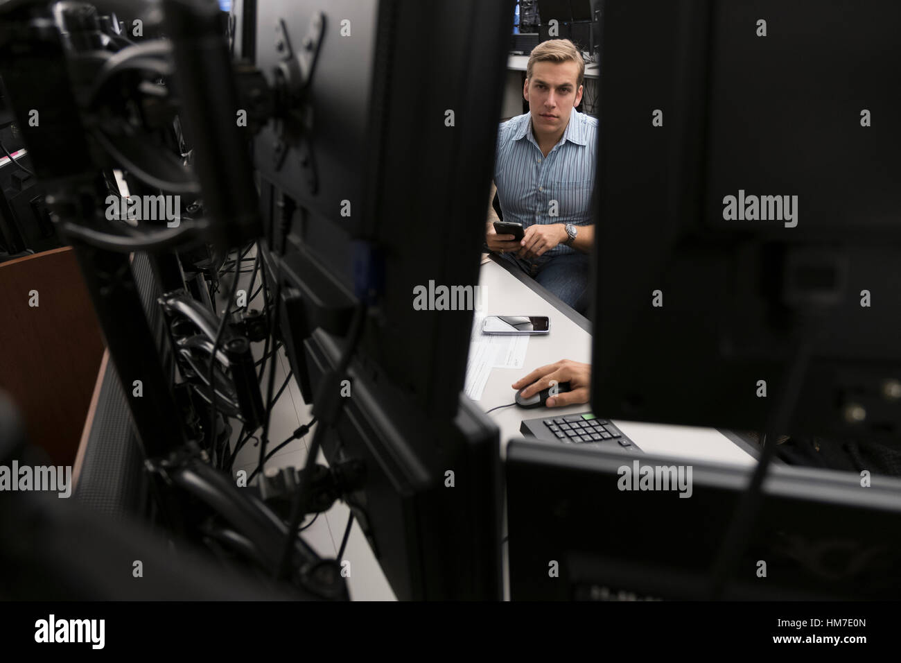 Young traders analyzing computer data Stock Photo - Alamy