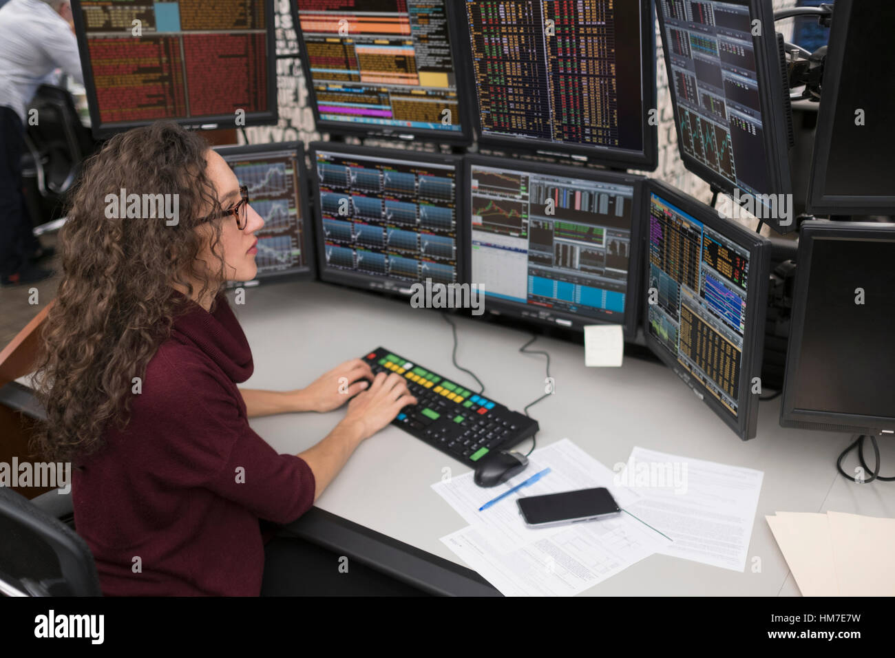 Young trader analyzing computer data Stock Photo - Alamy