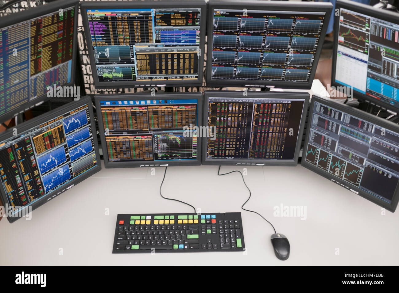 Desk with arrangement of computer monitors Stock Photo - Alamy