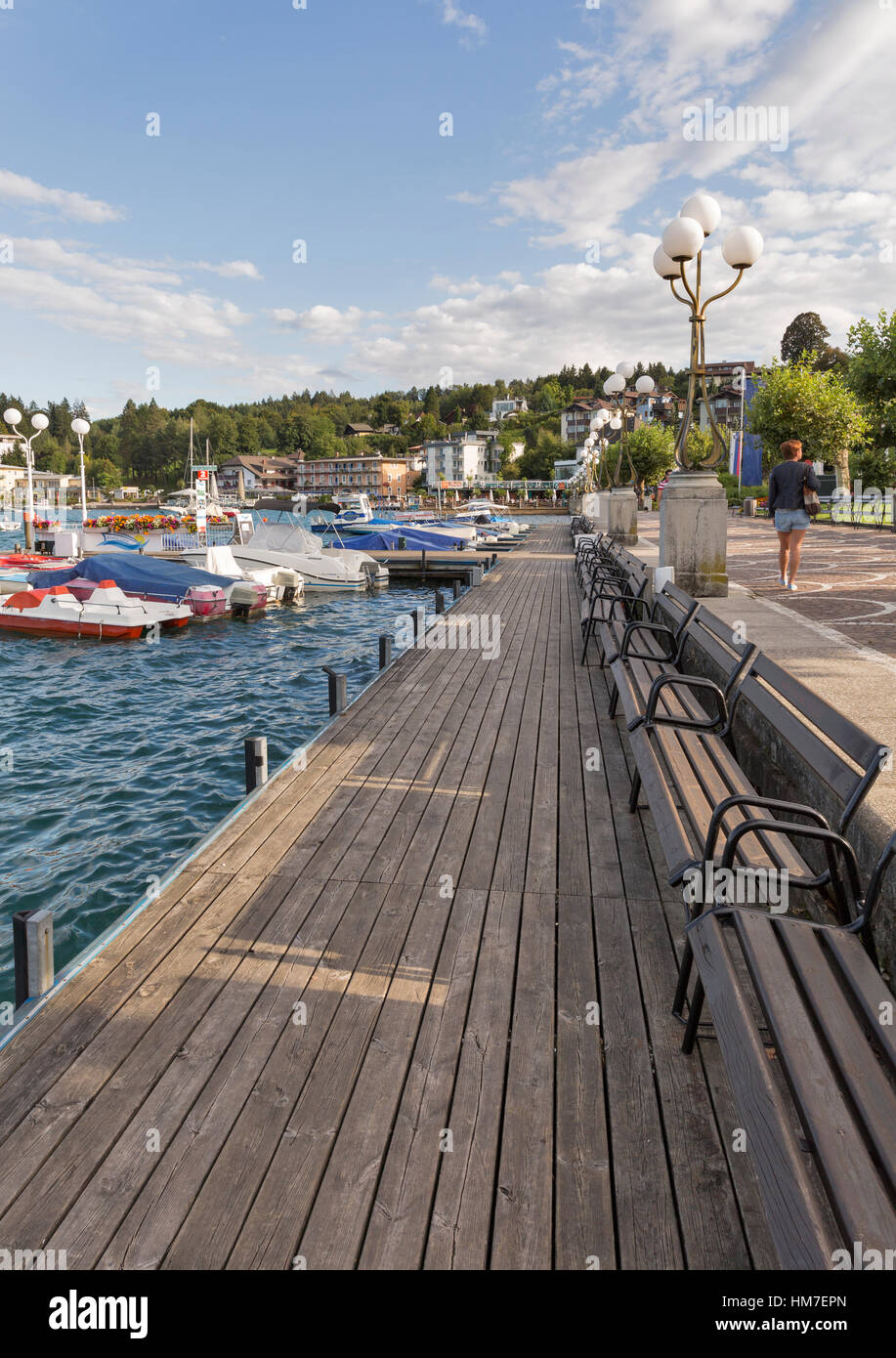VELDEN, AUSTRIA - SEPTEMBER 8, 2015: People walk along Worthersee lake ...