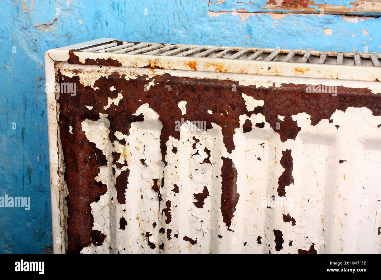 Rusty, destroyed, devastated, moldy radiator central heating at home ...