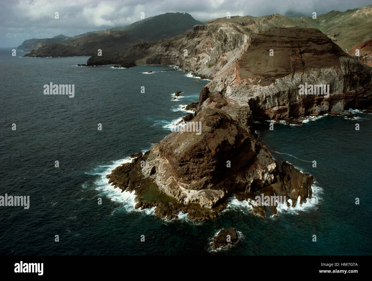 Rocky coast of Motu Mokoe, island of Ua Pou, aerial view, Marquesas ...