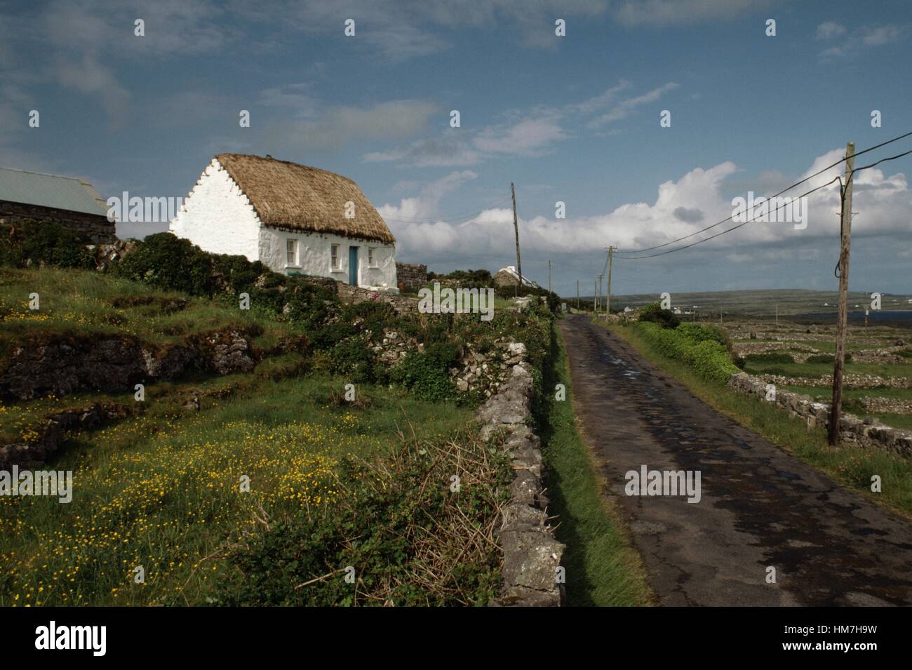 Thatched cottage and country road, Inishmore, Aran Islands, Ireland ...