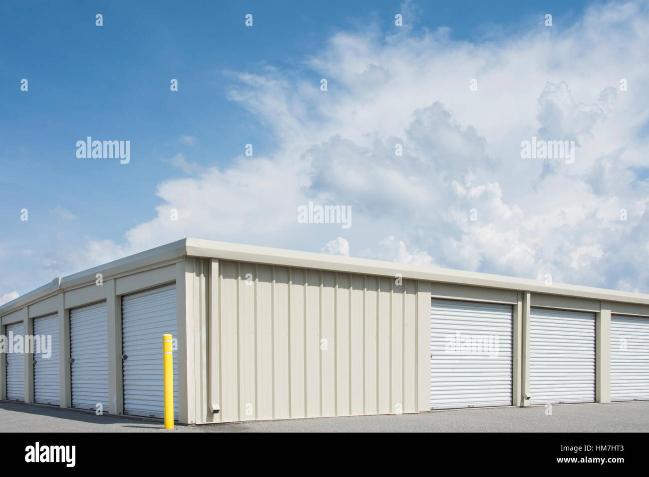 Blue sky over distribution warehouse Stock Photo - Alamy