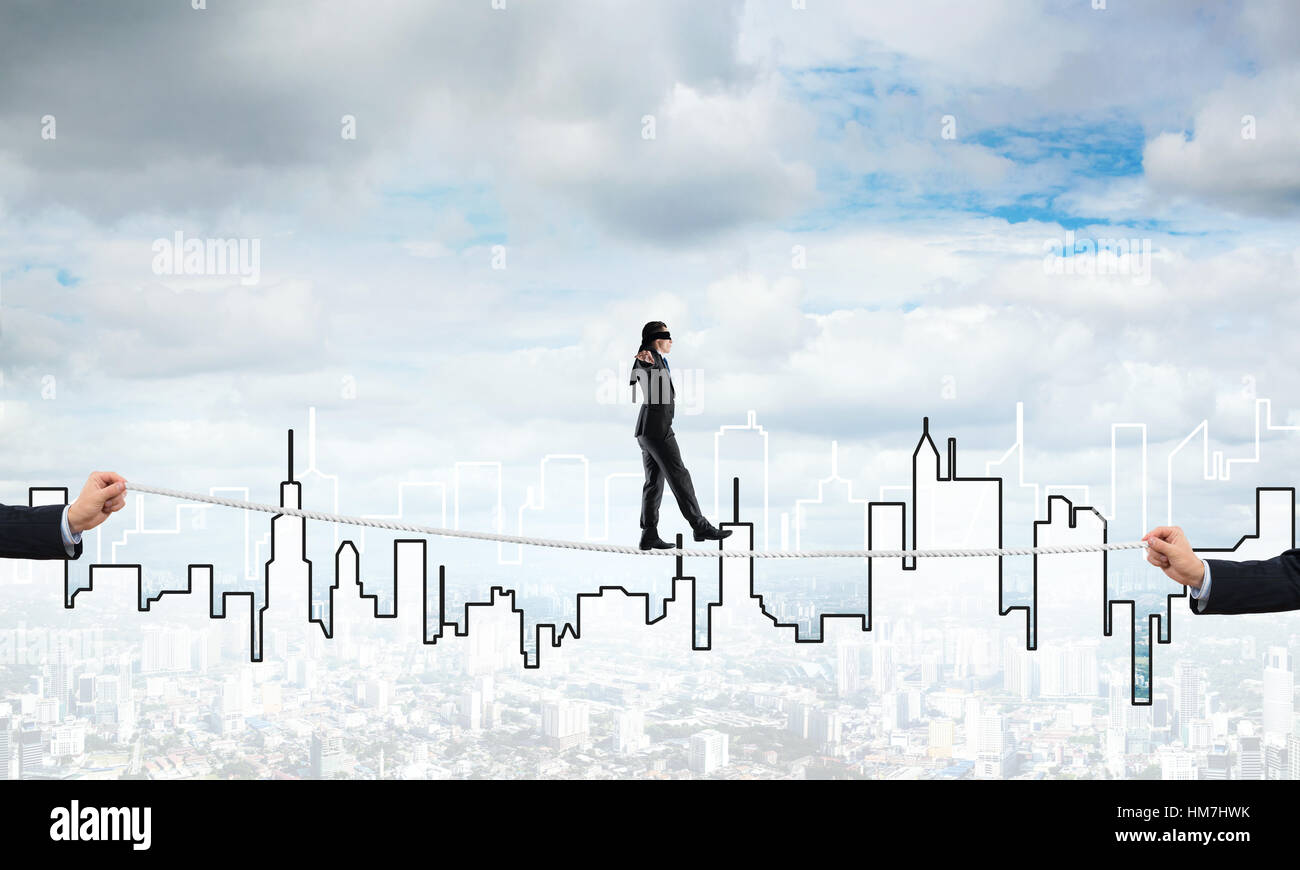 Business concept of risk support and assistance with man balancing on ...