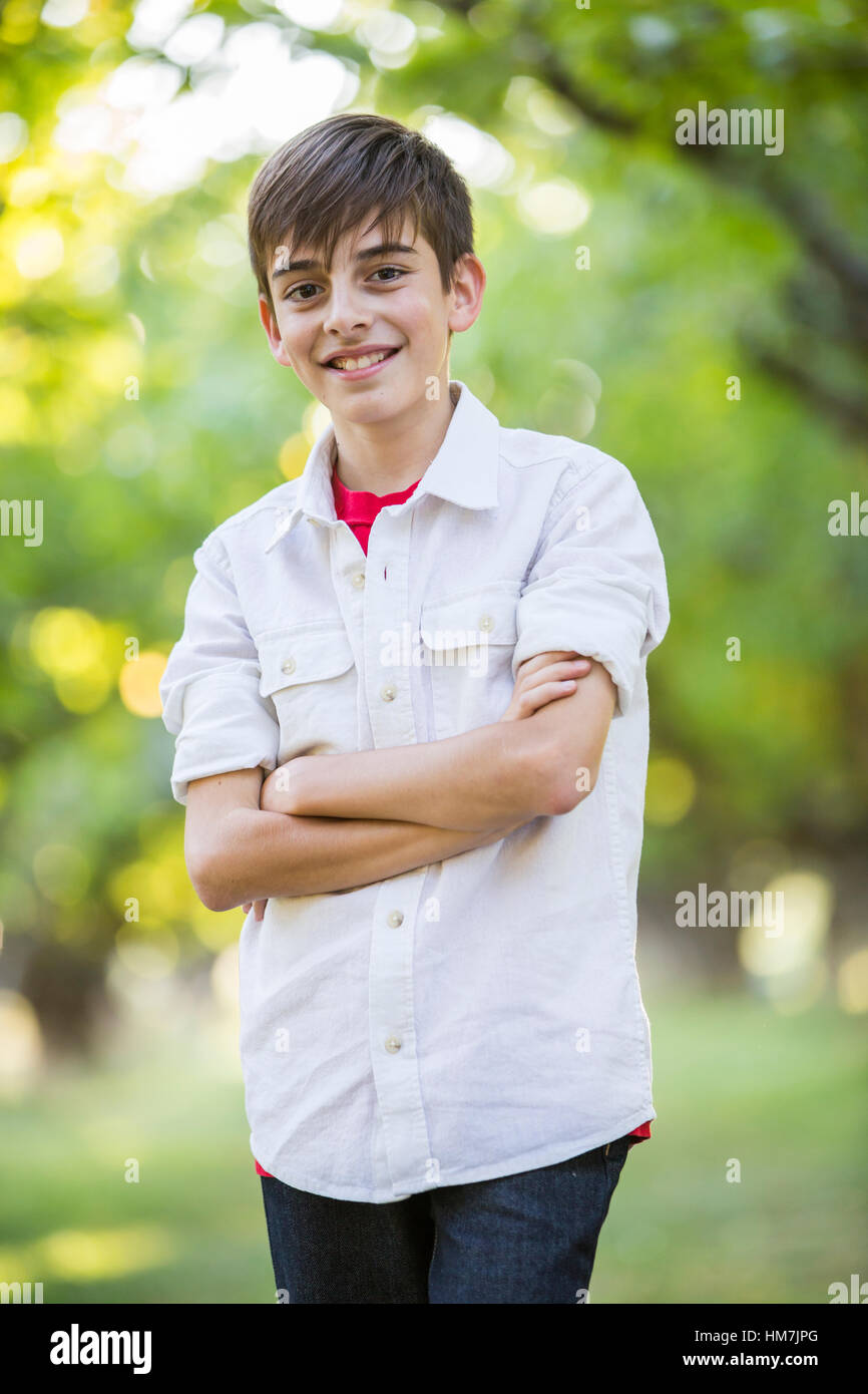 Boy standing arms crossed hi-res stock photography and images - Alamy