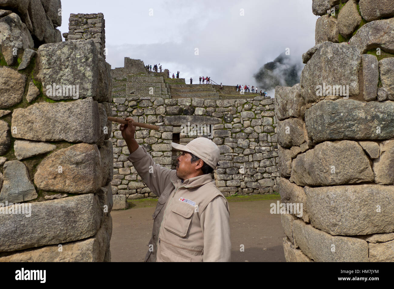 Restoration work at the Inca ruins of Macchu Picchu, Peru Stock Photo ...