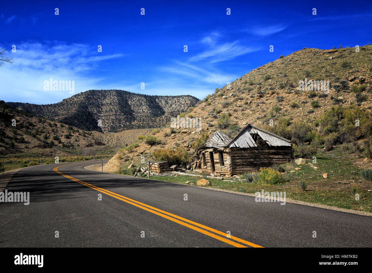An old, collapsing cabin sits along a scenic highway in Nine Mile ...