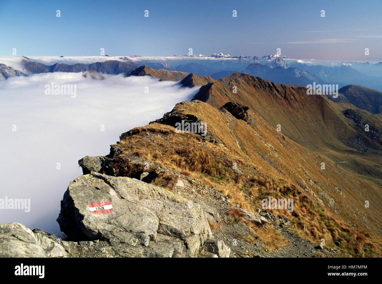 Clouds along the eastern ridge leading to the summit of Mount Crostis ...