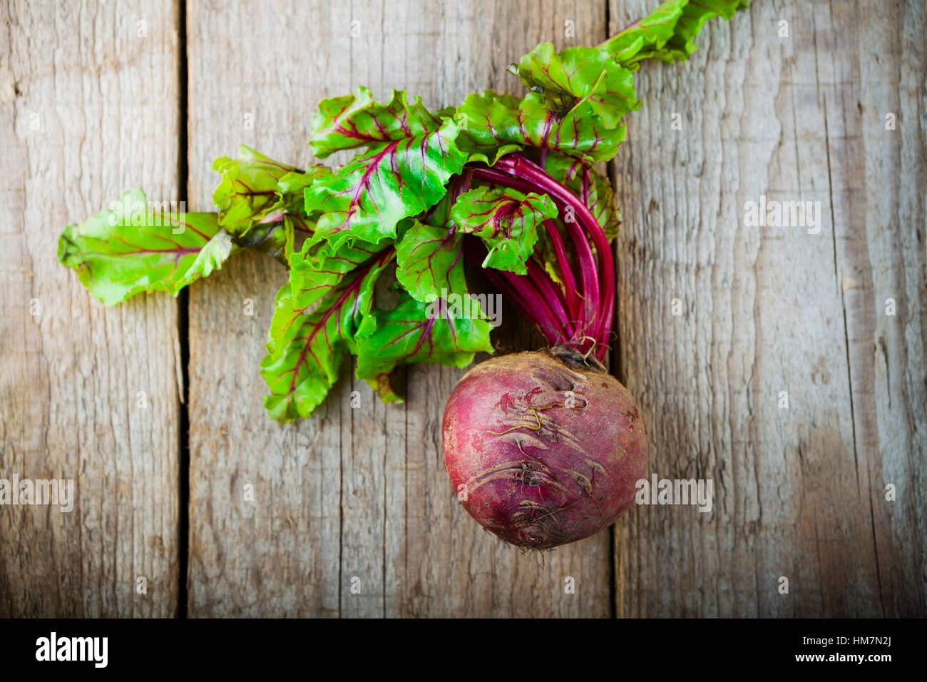 Fresh organic beet on a wood table Stock Photo - Alamy