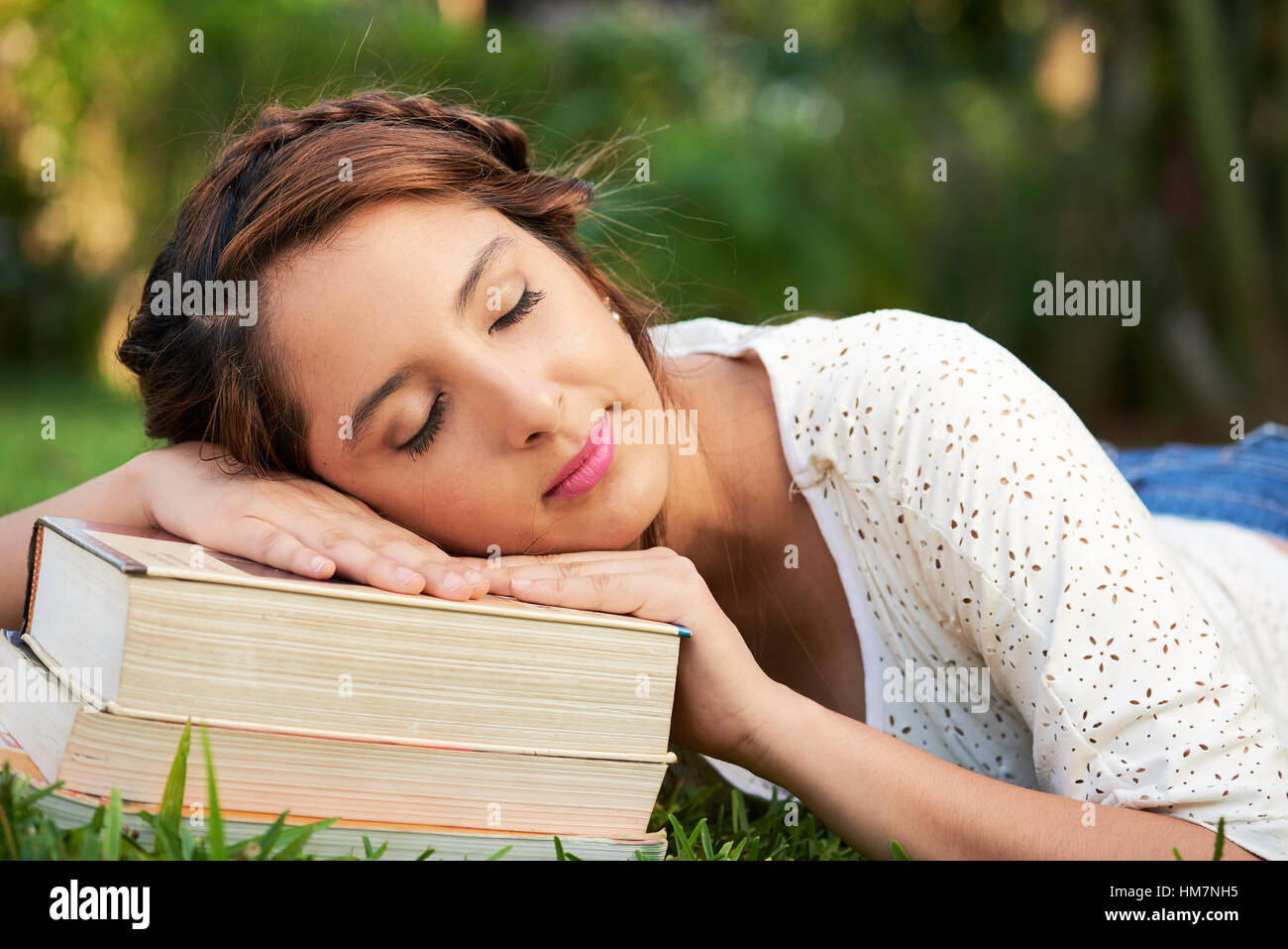 girl falling asleep while studying for an exam outdoor Stock Photo - Alamy