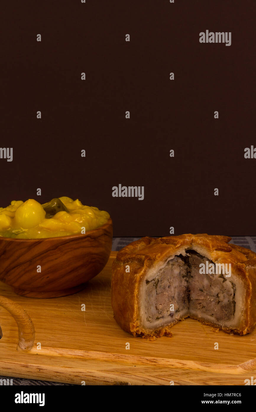 Piccalilli relish in a wooden bowl on a board Stock Photo - Alamy