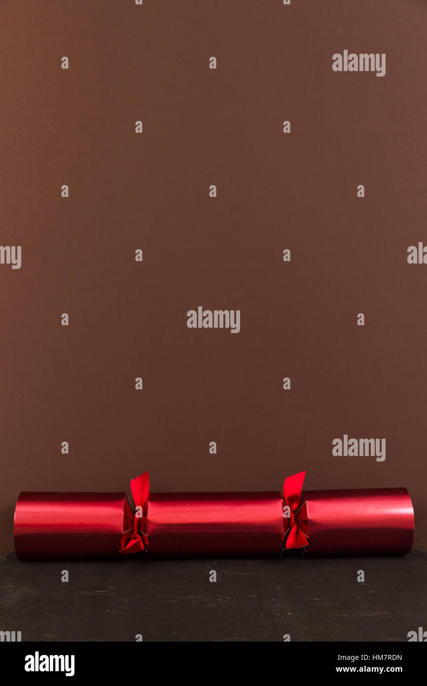 Red Christmas cracker with brown space above it Stock Photo - Alamy