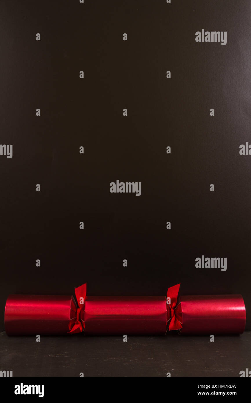 Red Christmas cracker with black space above it Stock Photo - Alamy